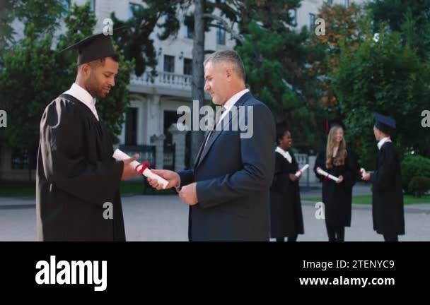 In the college garden graduation day college professor old man congrats ...