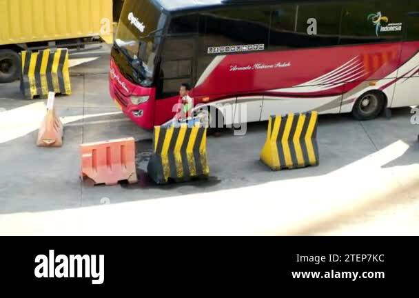Lampung, Indonesia 02 22 2022- The hawker man at Bakauheni port walks ...
