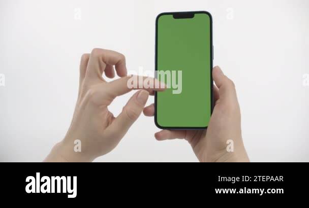 Woman Holding Smartphone With Green Screen, Scrolling Up and Tap Screen ...