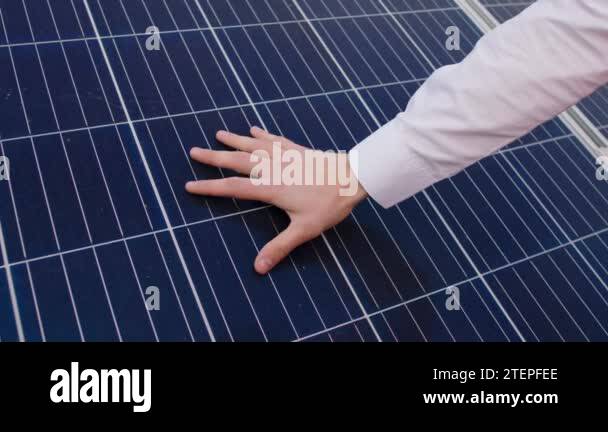 ecological engineer hands touching the solar panels to checking the ...