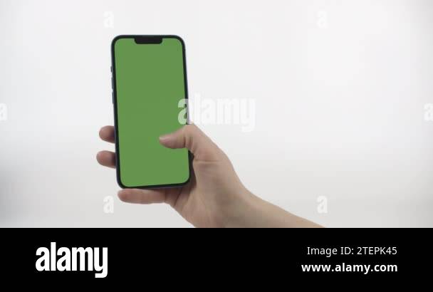 Woman Holding Smartphone With Green Screen, Scrolling Up and Tap Screen ...