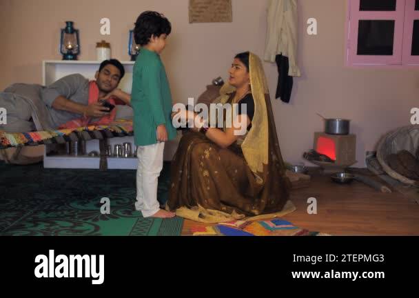 Small nuclear family in an Indian village home - Modern and educated ...