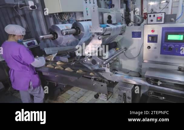 A modern conveyor for the production of ice cream. Ice cream production ...