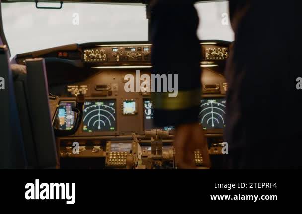 African American Captain Inserting Destination Coordinates To Help Pilot Before Takeoff Flying