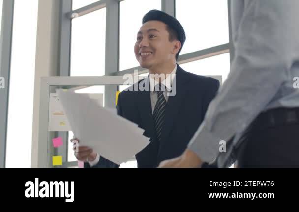 Executive and team people dancing and throwing documents celebrating ...