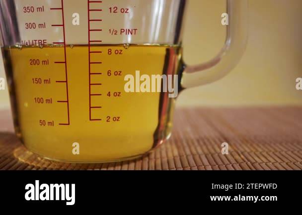 Measuring jug oil Stock Videos & Footage - HD and 4K Video Clips - Alamy