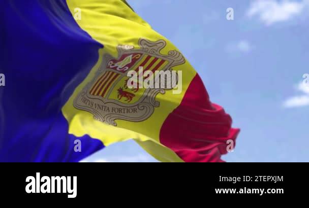 Detail of the national flag of Andorra waving in the wind on a clear ...