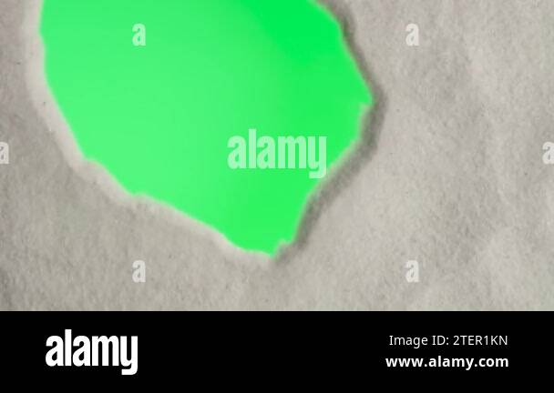 Dry clean sand is blown away demonstrating green screen chroma key ...
