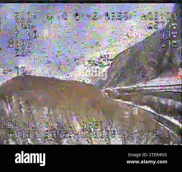 Digital crash effect on the camera from a drone with a view of green ...