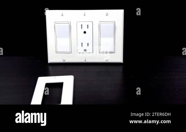 Two switches, a socket and three separate white, decorative, plastic ...
