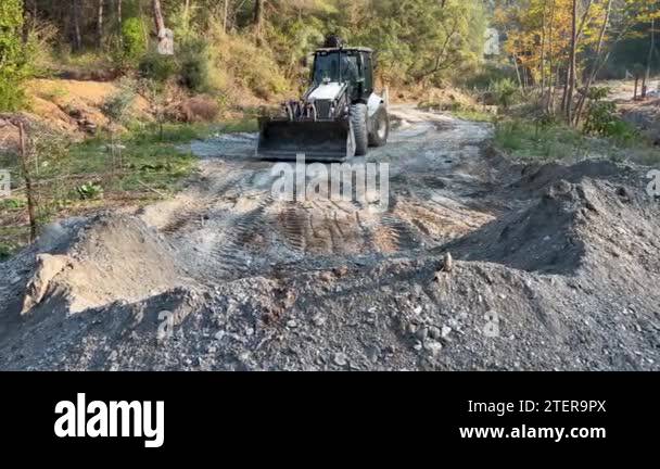 Mugla, Turkey - March 2022: Mini bulldozer clearing forest for new road ...