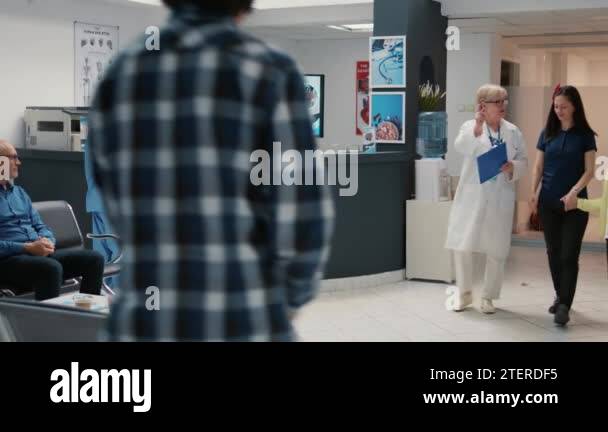 Busy hospital reception desk with diverse people in waiting room, asian ...