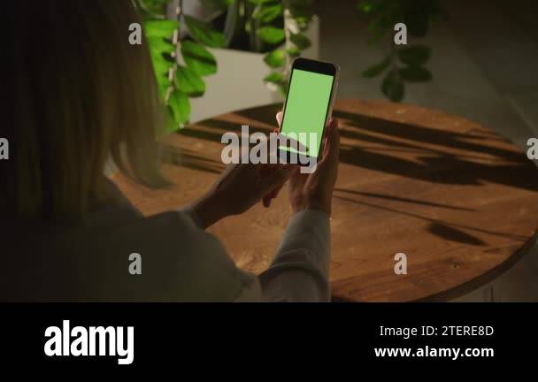 Handheld close up of a caucasian woman hand holding smart phone with ...