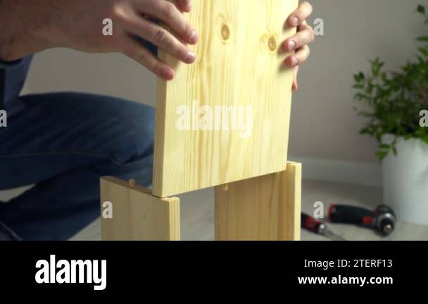 Man assembling flat pack Stock Videos & Footage - HD and 4K Video Clips - Alamy