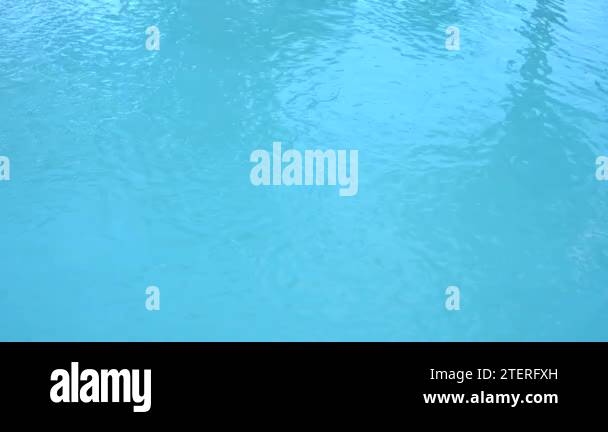 Water surface texture, Slow motion looping clean swimming pool ripples ...
