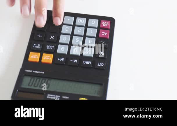 4K Top view man hand using calculator on office desk. Male hand press ...