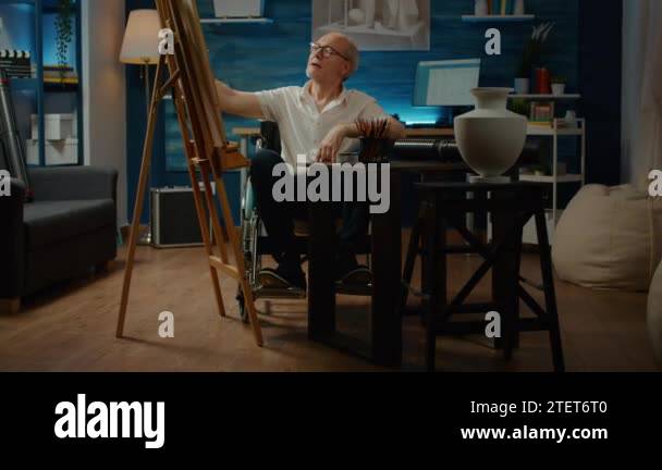 Old artist with physical impairment using pencils to draw vase sketch ...