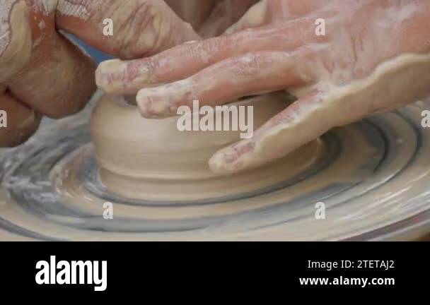 Clay modeling master class. Teacher show children hands clay pot ...