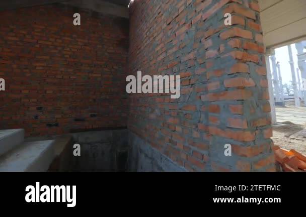 Inside the house that is being built. Unfinished house. Staircase in an ...