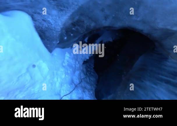 Descent into a deep ice cave. The climber descends Stock Video Footage ...