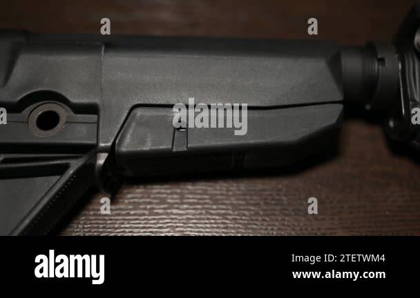 slow slide from AR15 assault rifle stock to trigger and shell ejection ...