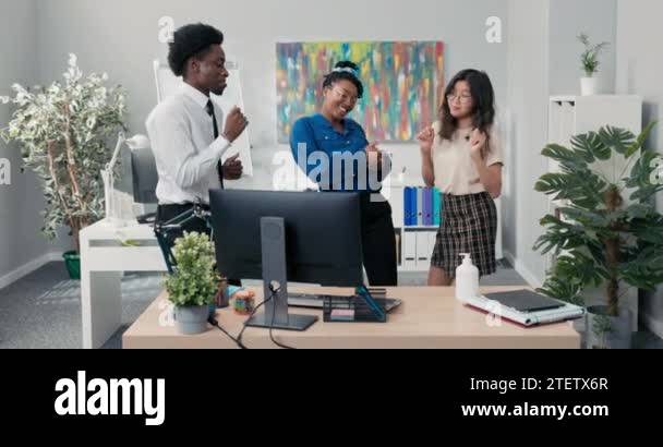 Dance at work, office, break from duties, company party, two girls and ...