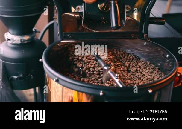 Side view of coffee beans cooling in cooling tray after being roasted ...