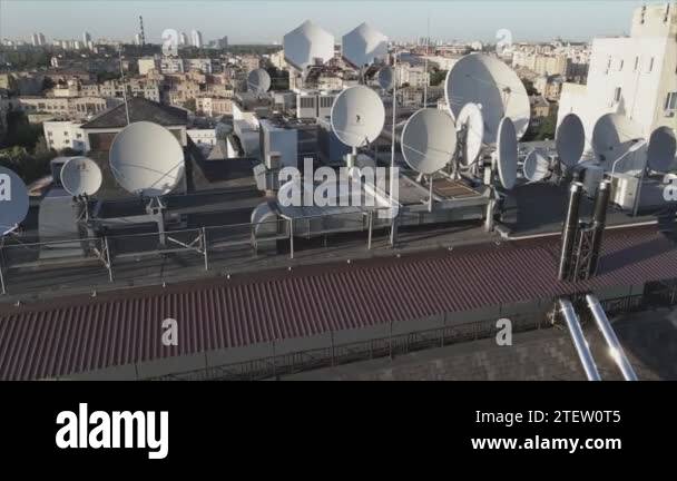 This stock video shows an aerial view of a circular TV antenna on the ...