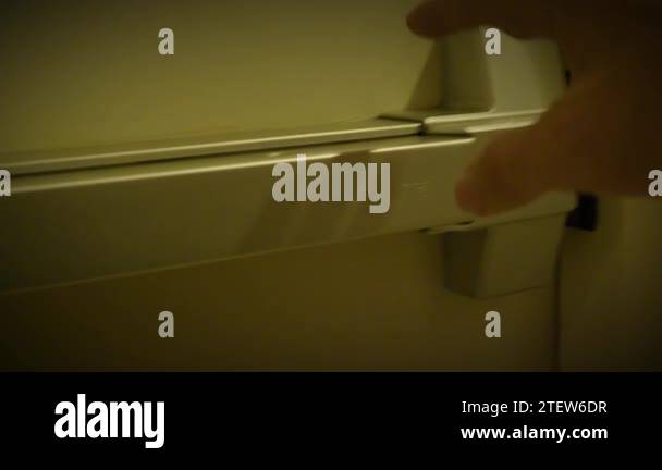 Fire exit door. Man hand open the fire door to staircase hallway ...