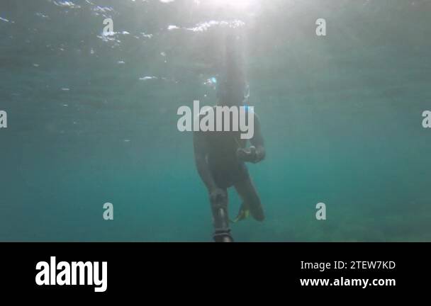 A man holds a compass in his hand and looks for direction while ...