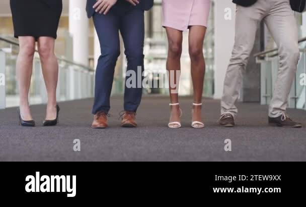 Legs of business people dancing, celebrating and being playful while ...