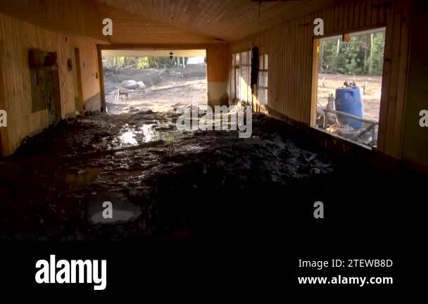 An abandoned building covered by volcanic lahar after Calbuco Volcano ...