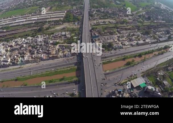 Traffic flows over at the junction with canal, bridge highway Stock ...