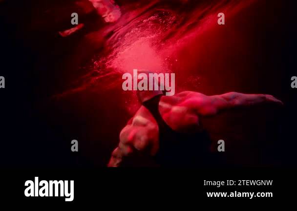 epic underwater shot with strong and powerful man with huge muscles ...