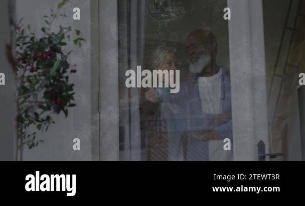 Animation of moving background over sad senior diverse couple embracing ...