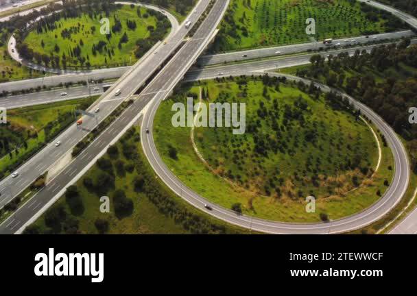 Aerial view of highway junctions with roundabout. Bridge roads shape ...