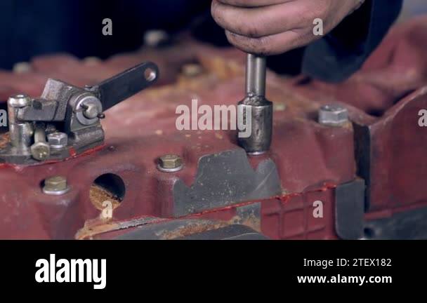 Worker tight nuts on motor, engine by automatic screwdriver Stock Video ...