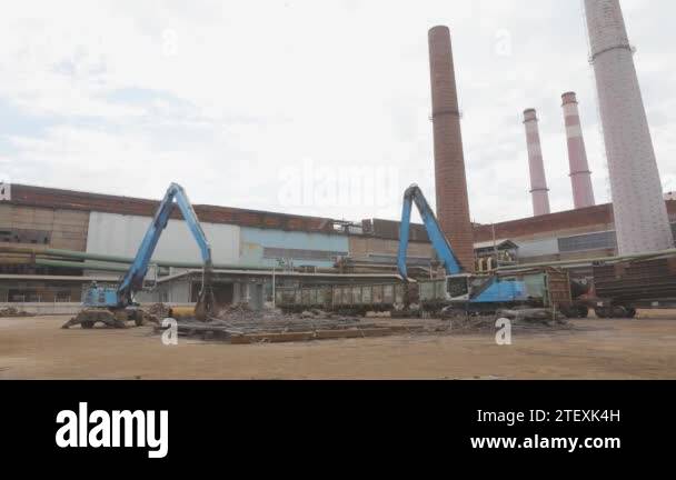 Recycling of metal. Excavator with grab. Recycling metal waste, metal ...