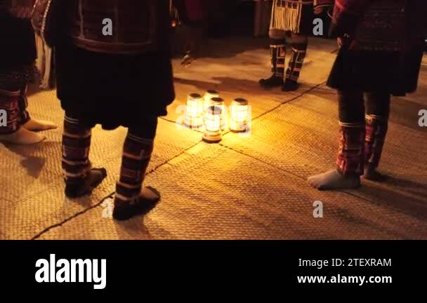 Indigenous performing arts to tourists. At night dimly light, Akha hill ...