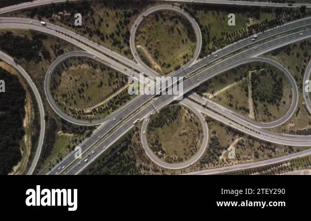 Aerial view of highway junctions with roundabout. Bridge roads shape ...
