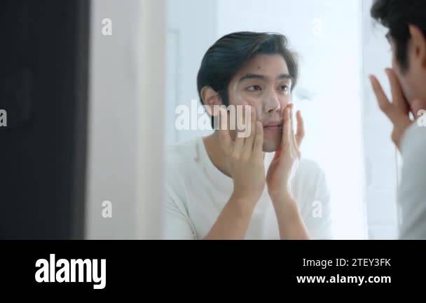Health concept of 4k Resolution. Asian man washing his face with water ...