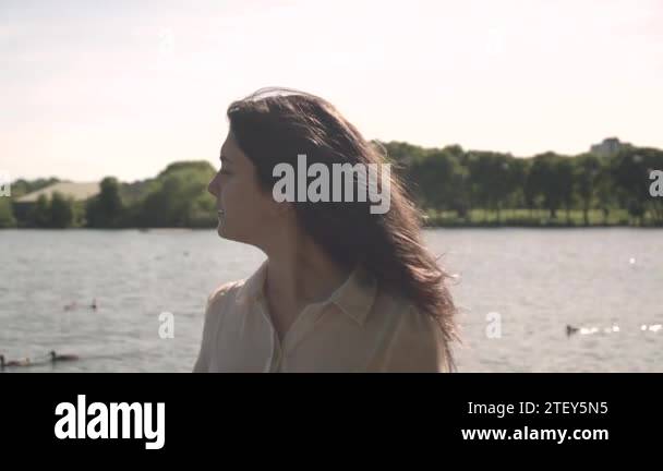 Sunset Portrait of an adorable and beautiful Italian model walking next ...