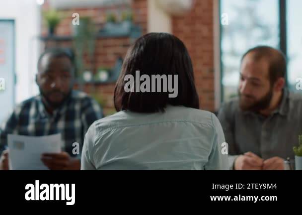 Back view of african american candidate attending job interview Stock ...
