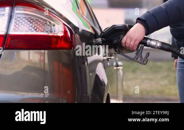 Process of refueling car fill with petrol fuel at the gas station, pump ...