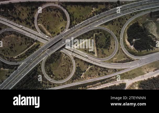 Aerial view of highway junctions with roundabout. Bridge roads shape ...