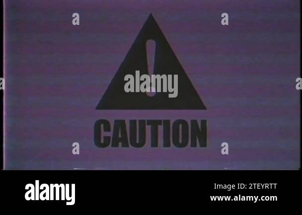 Caution warning sign on TV with VHS damage effect, retro technology ...