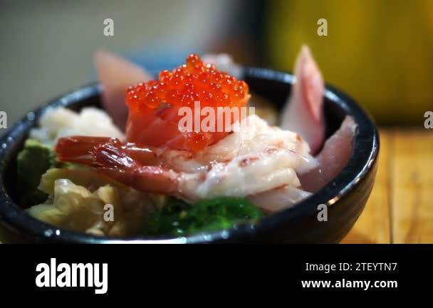 Japanese gourmet sashimi over rice bowl. Chirashi Assorted seafood ...