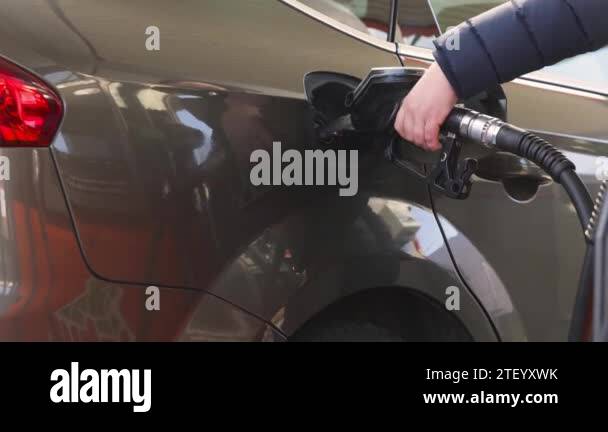 Process of refueling car fill with petrol fuel at the gas station, pump ...