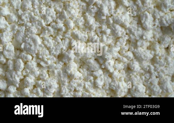 Cottage cheese of background, top view, rotates. White grainy texture ...