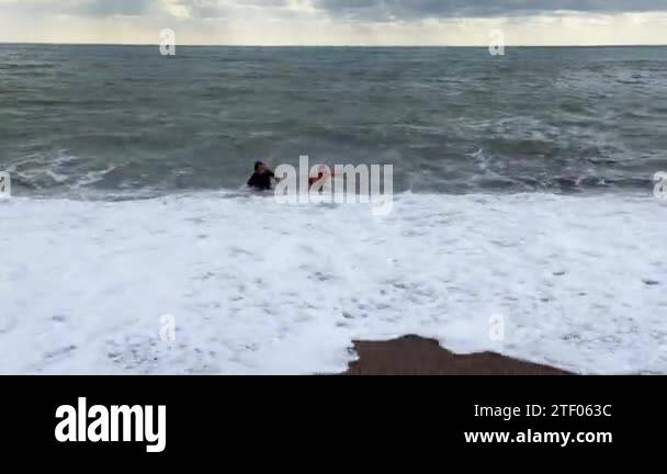 Two young men went swimming in the sea during a storm, and now they are ...